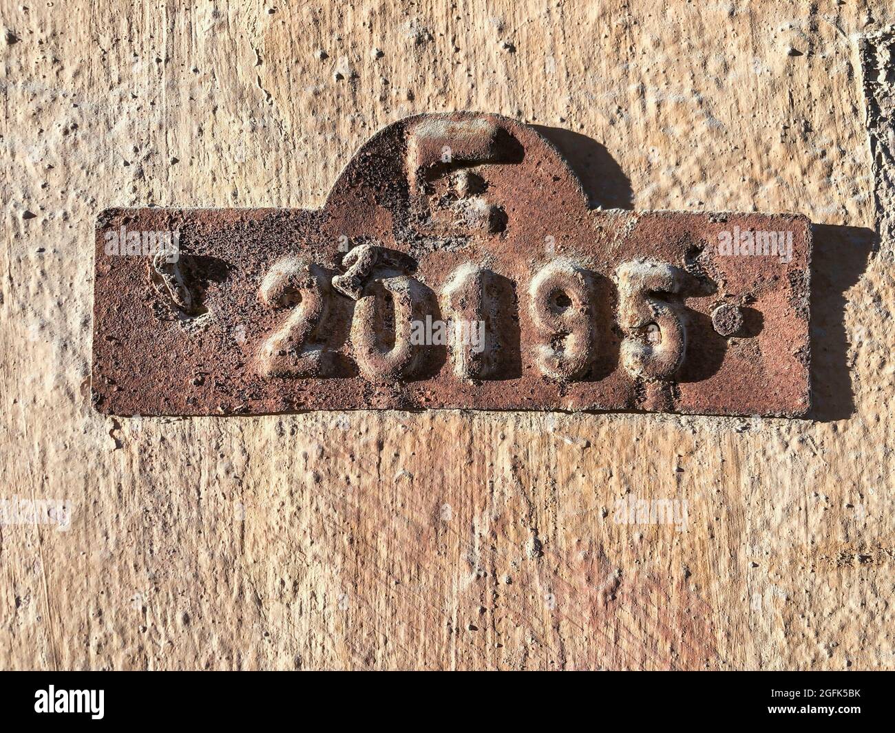 Old and rusty door number hanged on wall with copy space Stock Photo ...