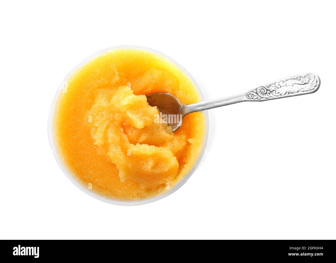 Jar with orange scrub and spoon isolated on white Stock Photo - Alamy