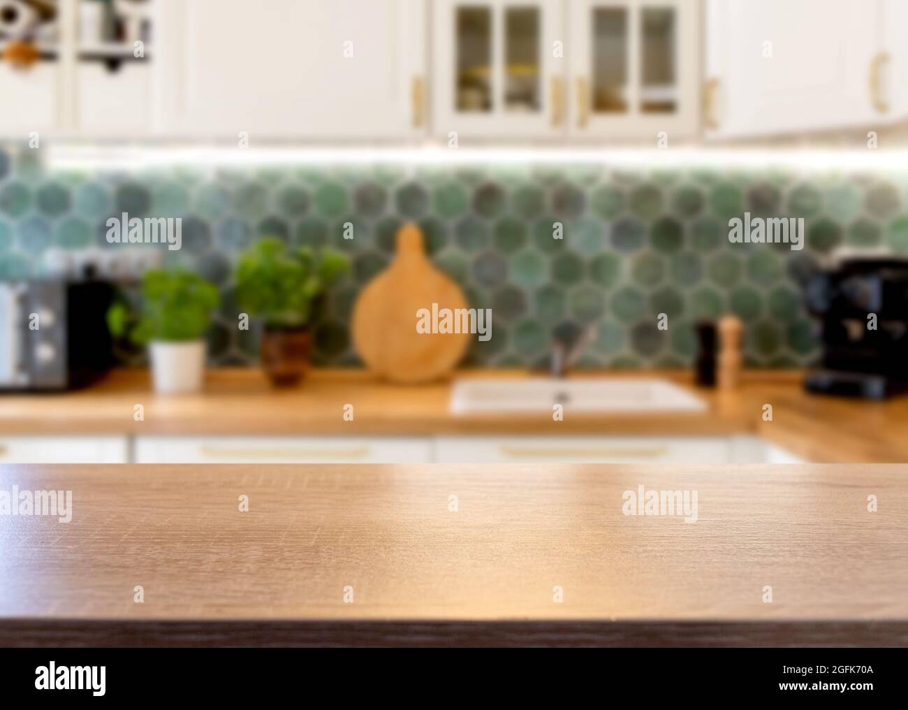 blurred kitchen interior and wooden desk space home background Stock ...