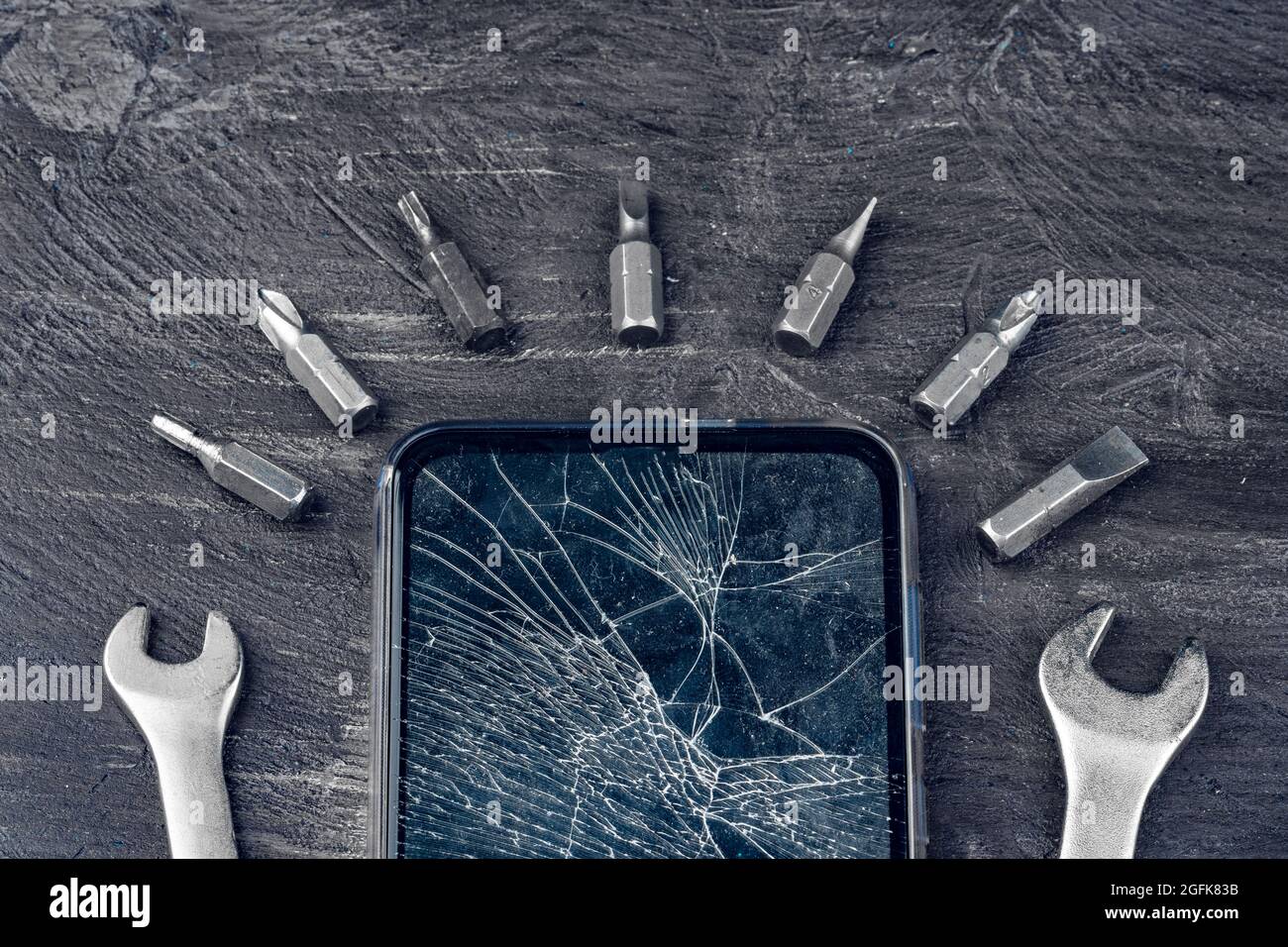 Digital gadget with tools. Repairing smartphone concept Stock Photo - Alamy