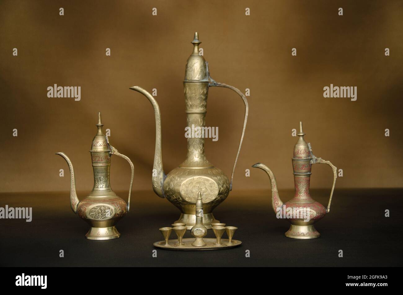 Set of traditional Brass Surai (pot) on Brown background Stock Photo ...