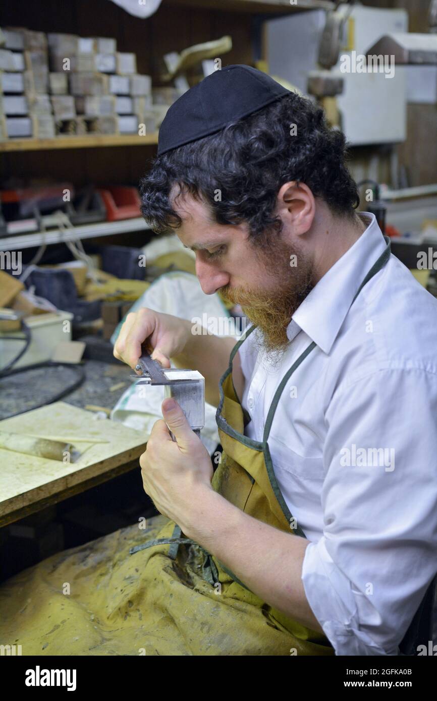 A rabbi & master craftsman makes leather tefillin boxes in a home ...