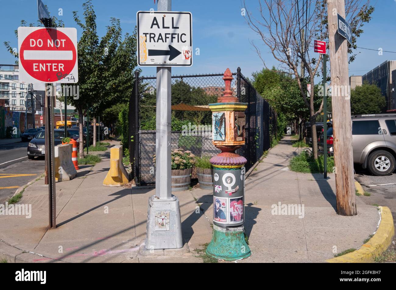 A street corner in Astoria, Queens with an ornate decorated fire alarm ...