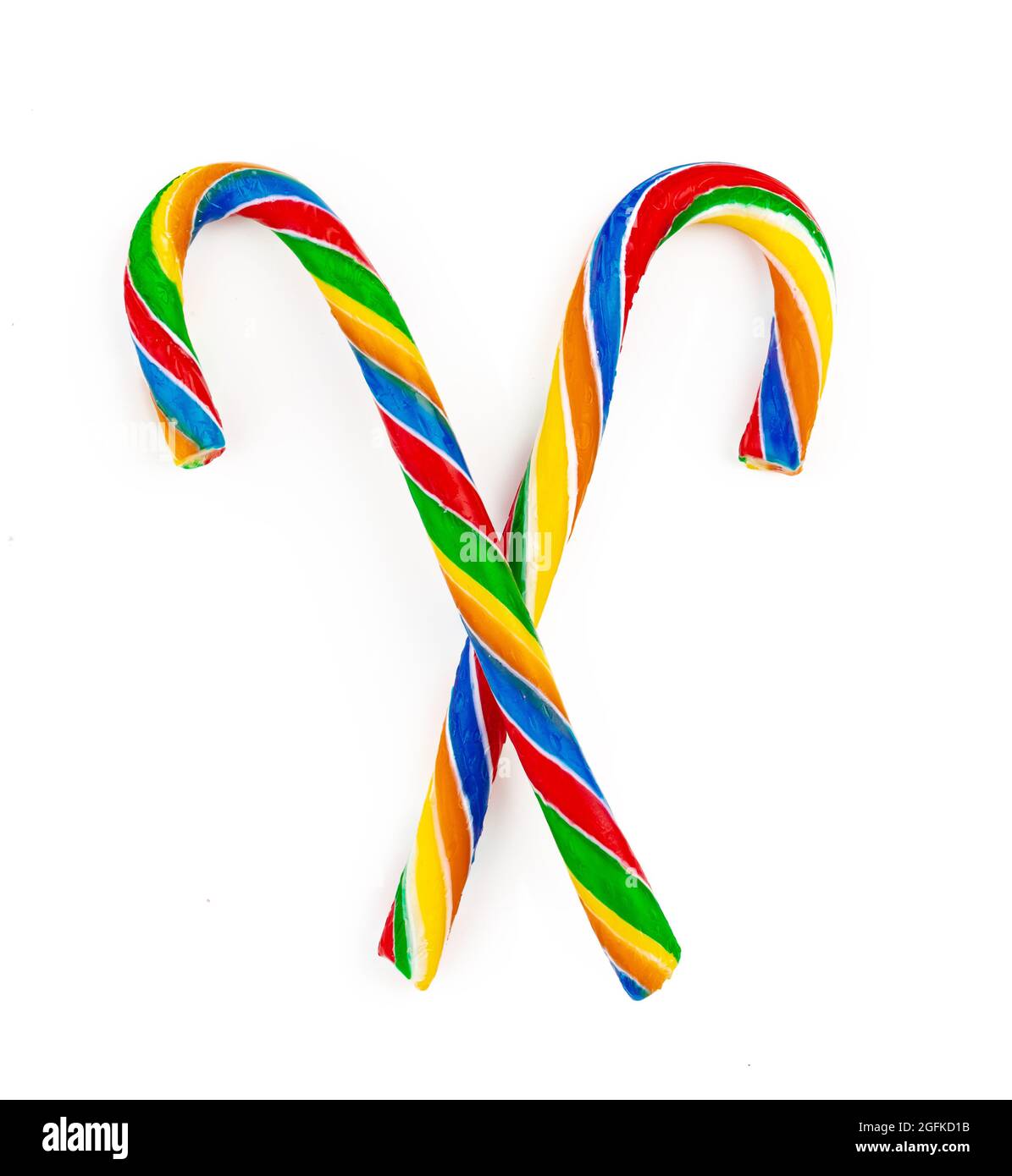 Rainbow colored candy cane isolated on white background Stock Photo - Alamy