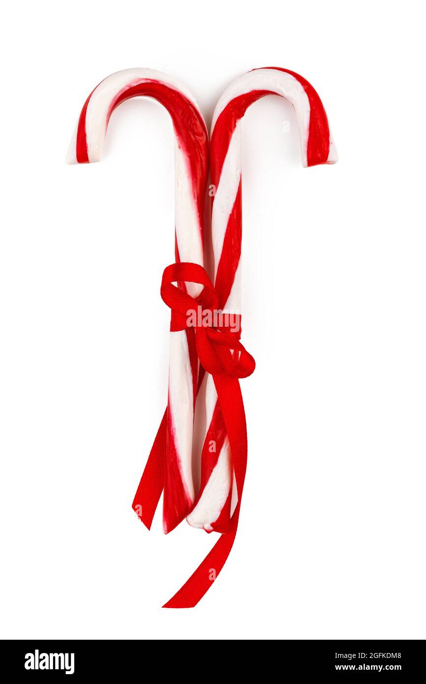 Two candy canes isolated on white background Stock Photo - Alamy