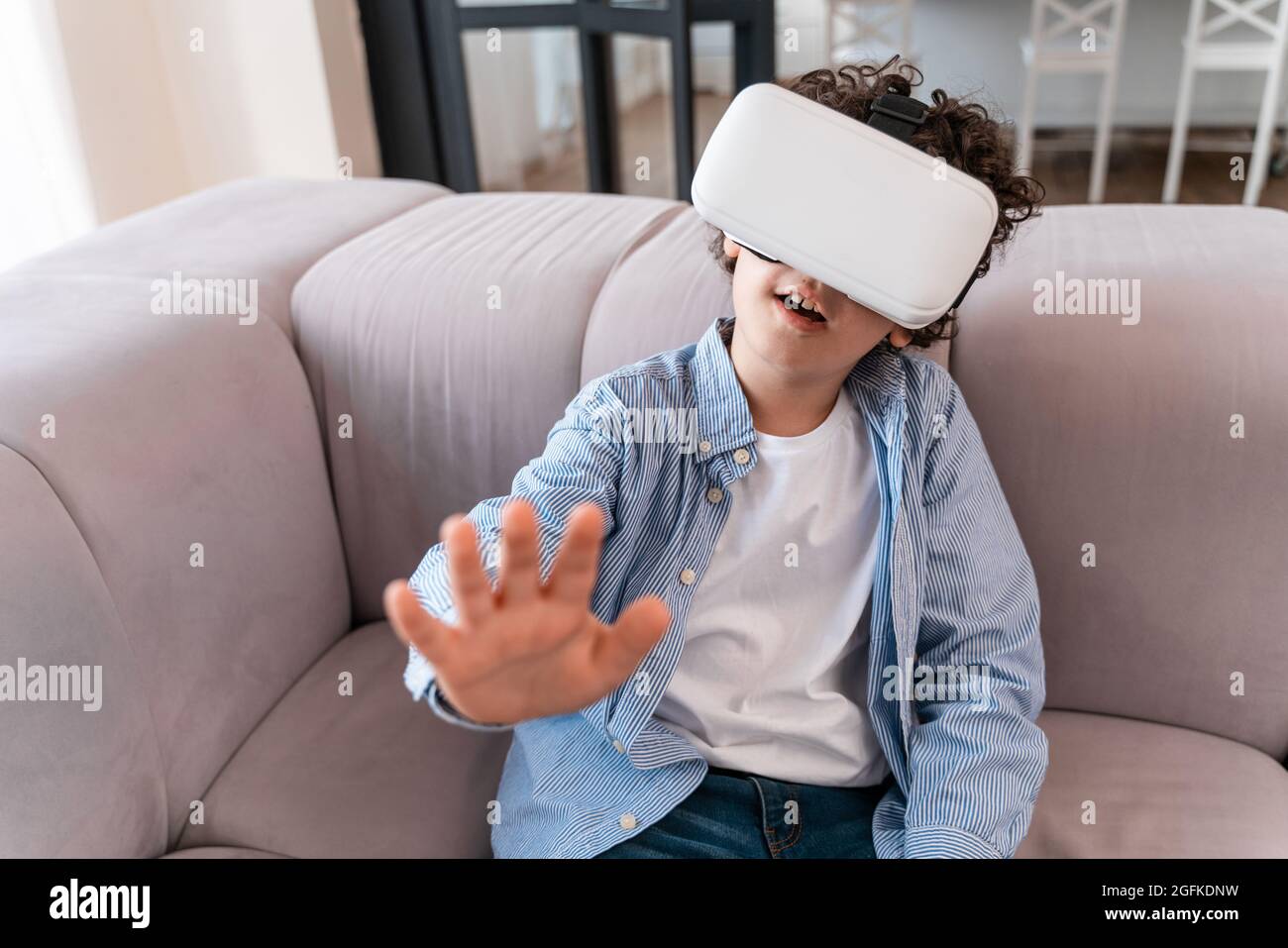 little kid using vr glasses. Concept about childhood and technology ...