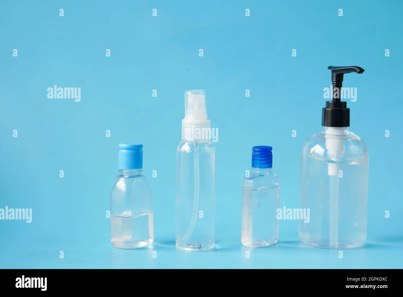 hand wash liquid in a container onblue background Stock Photo - Alamy