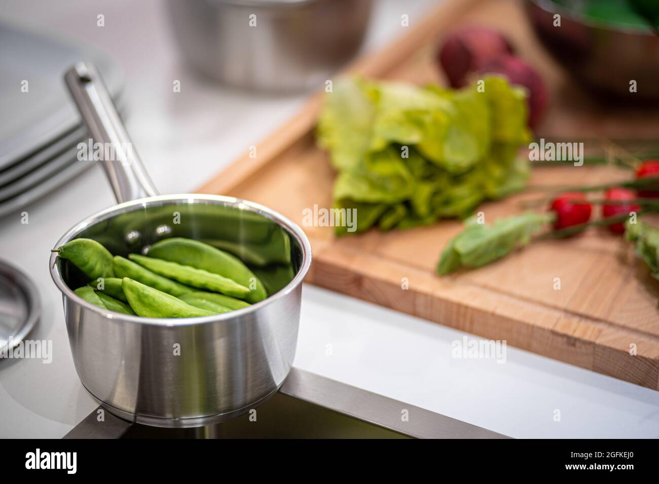 image of aluminium pot with vegetables on the kitchen table Stock Photo ...