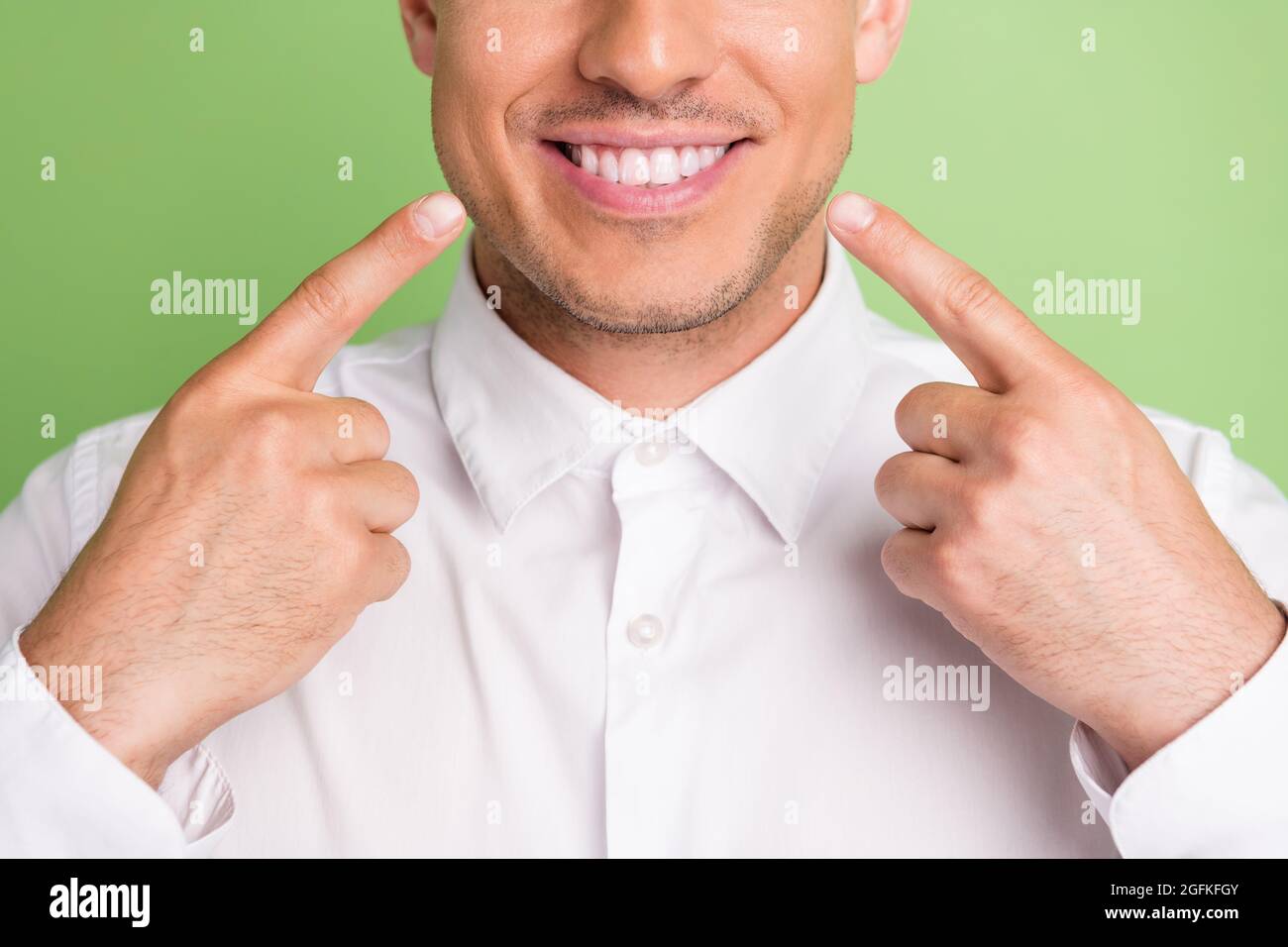 Photo of handsome cute young gentleman wear white shirt pointing finger ...