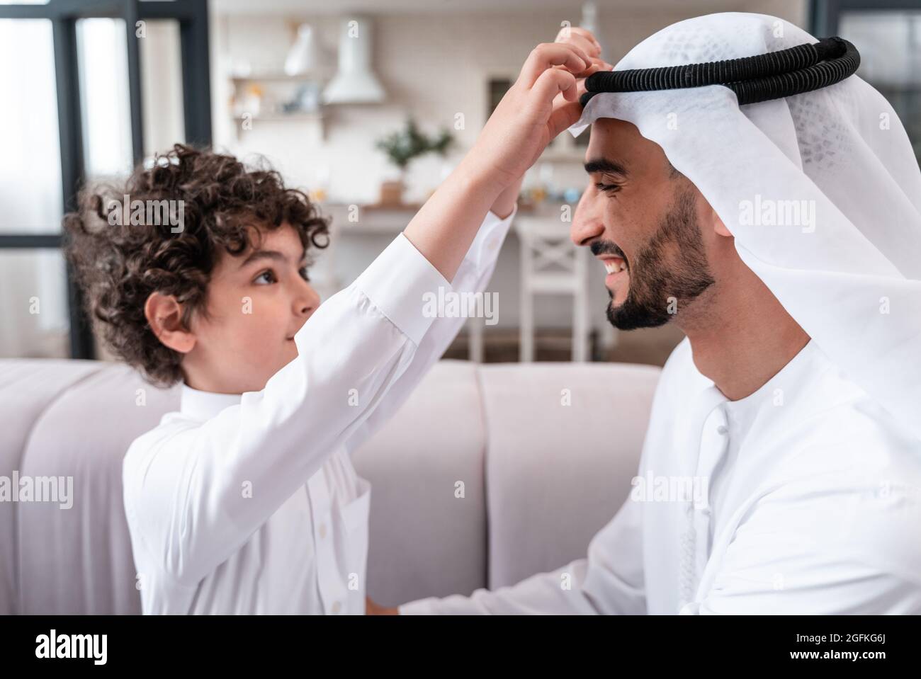 happy family spending time together. Arabian father and his son ...