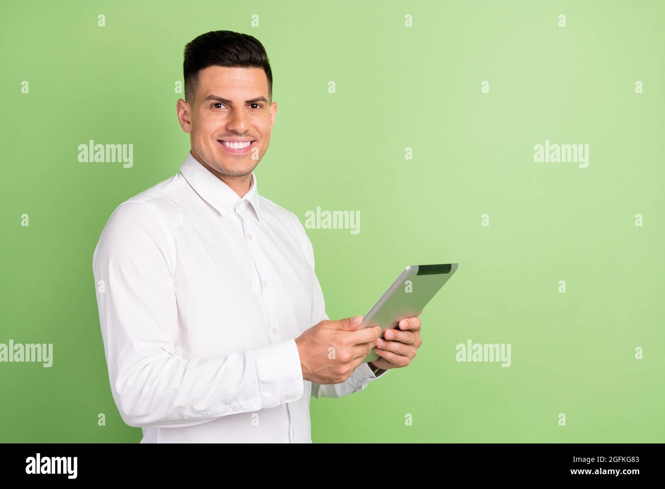 Photo of sweet charming young gentleman wear white shirt smiling ...