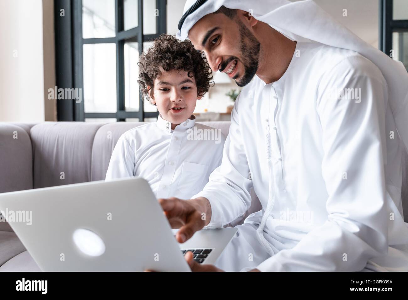 happy family spending time together. Arabian father and his son ...