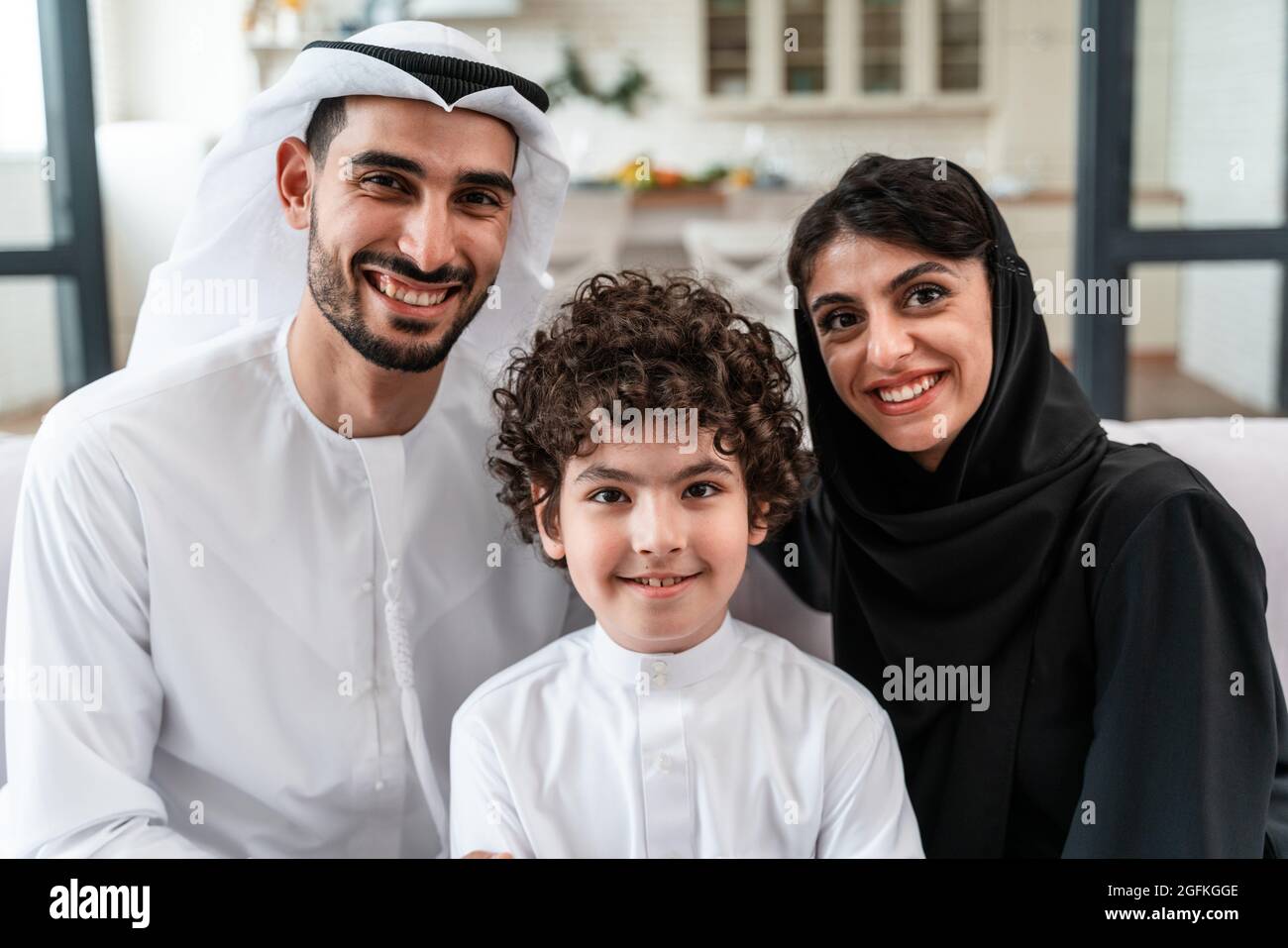 happy family spending time together. Arabian parents and their son ...