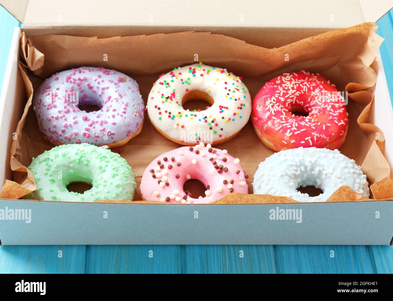Delicious donuts in box, closeup Stock Photo - Alamy