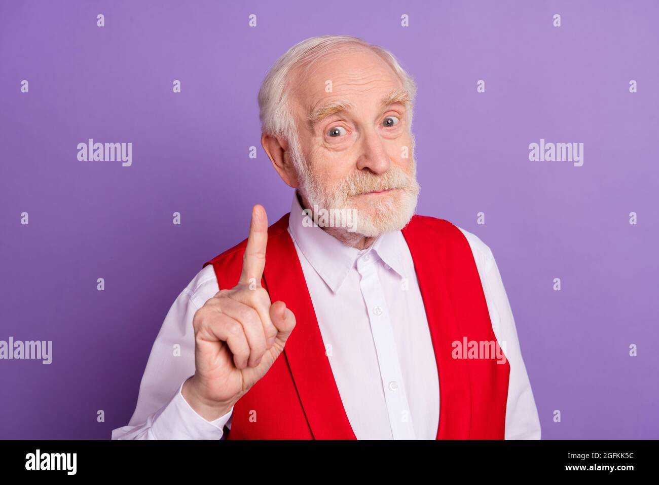 Photo of happy old man hold finger attention caution warning wear red ...