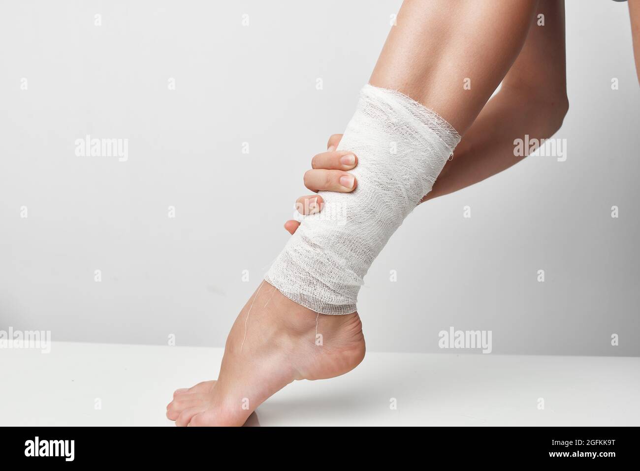 bandaged leg injury close-up health problems Stock Photo - Alamy