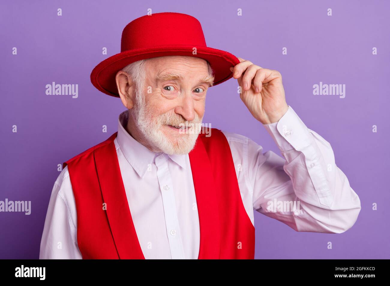 Photo of cheerful happy positive old man wear red hat good mood smile ...