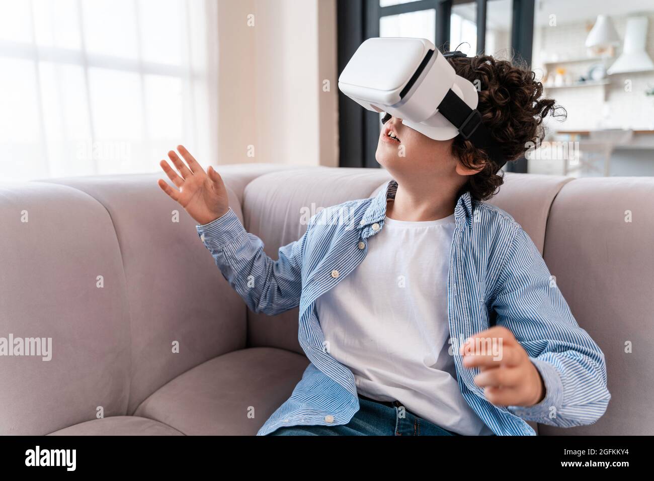 Little kid using vr glasses. Concept about childhood and technology ...