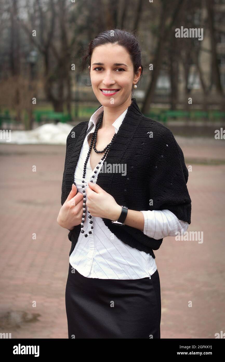 Confident, young girl smiles on the street Stock Photo - Alamy