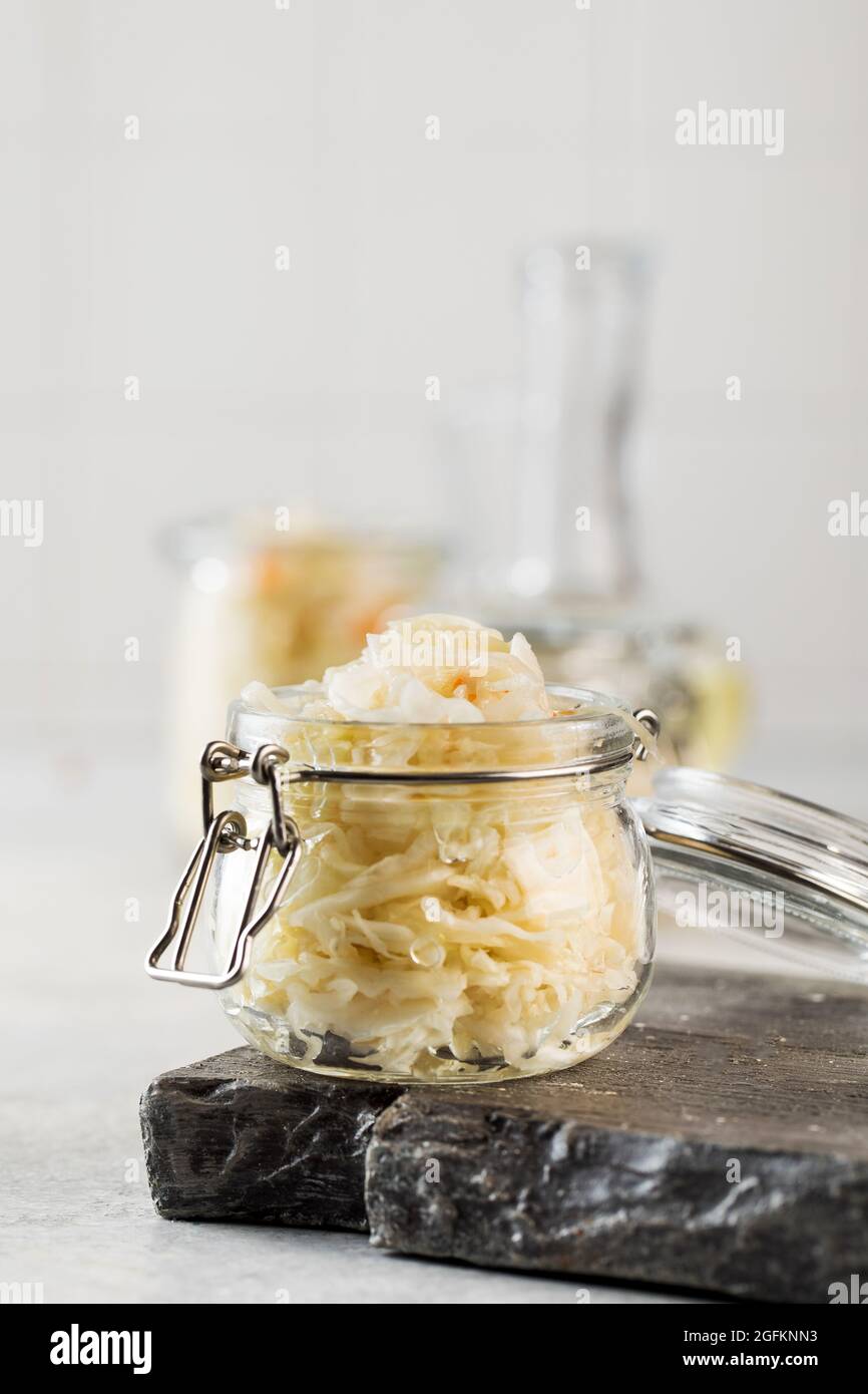 Sauerkraut in glass jars. Fermentation and canning of vegetables Stock ...