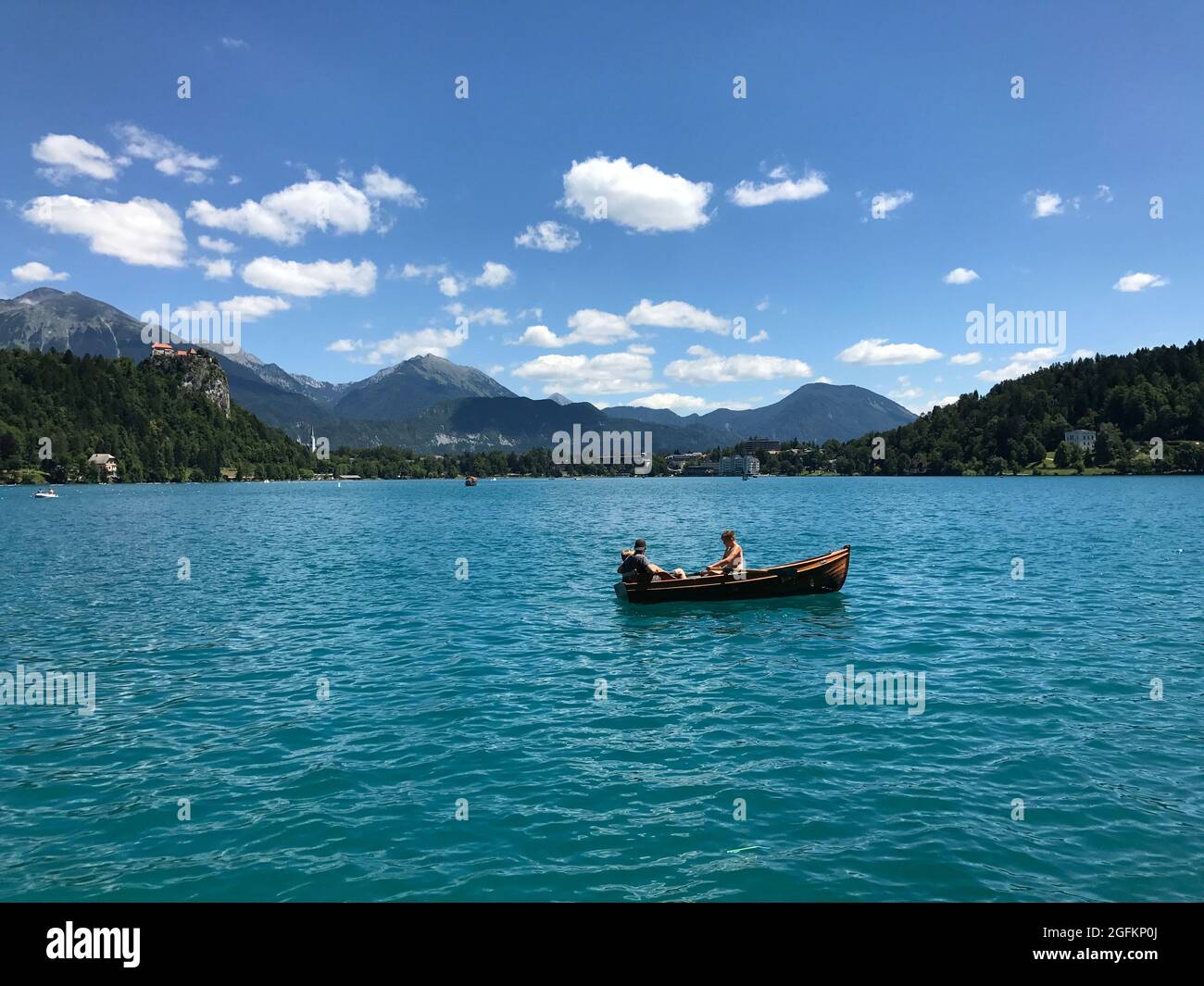 Couple rowing on a small boat at Lake Bled, Slovenia Stock Photo - Alamy