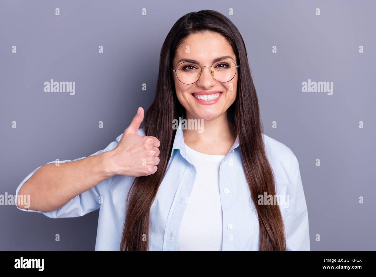 Photo of charming sweet young lady dressed blue shirt glasses smiling ...