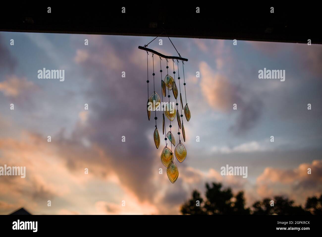 Wind chimes, tree hi-res stock photography and images - Alamy