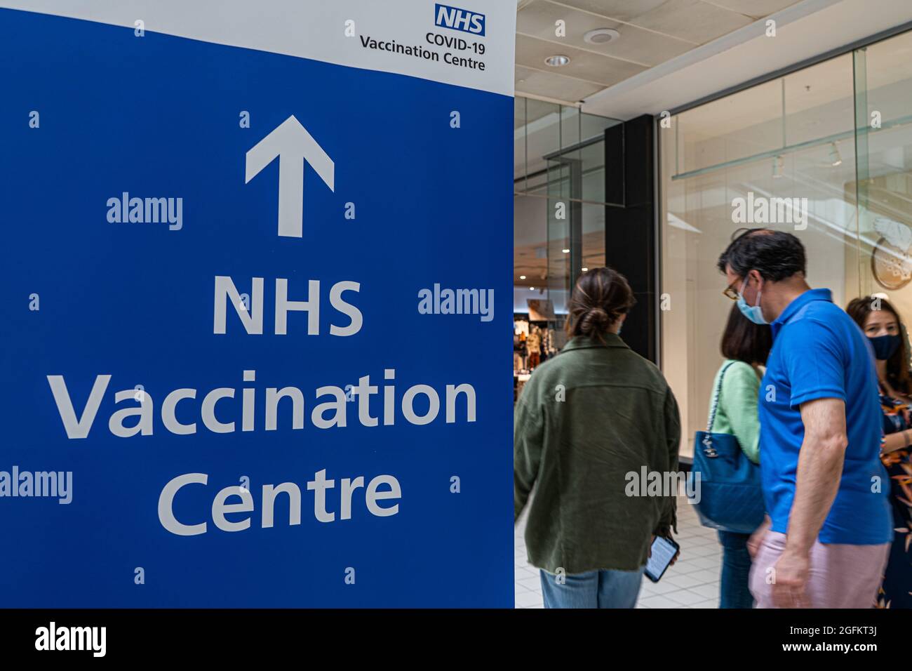 An NHS vaccination centre sign at Wimbledon Centre Court shopping mall ...