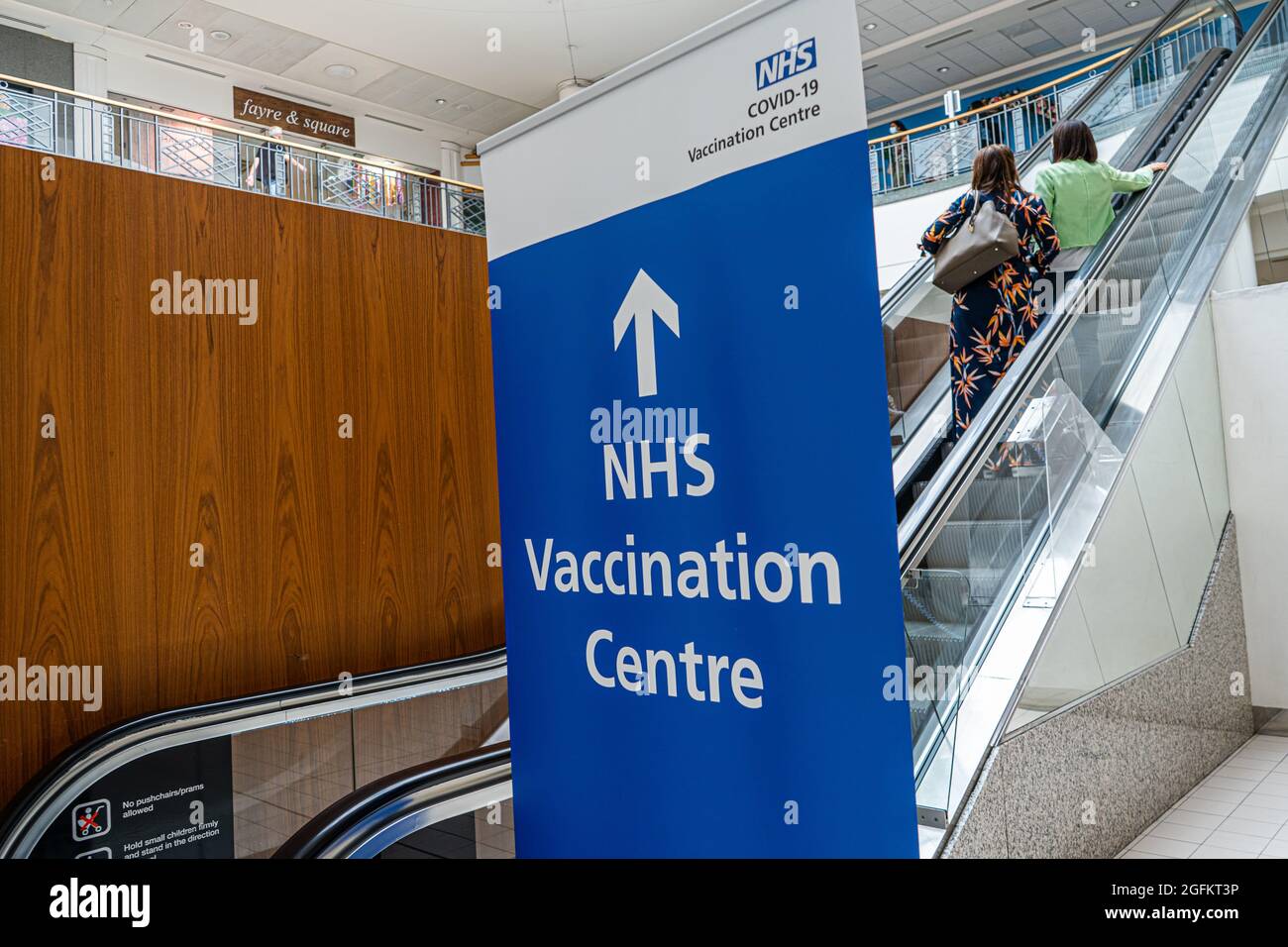 An NHS vaccination centre sign at Wimbledon Centre Court shopping mall ...