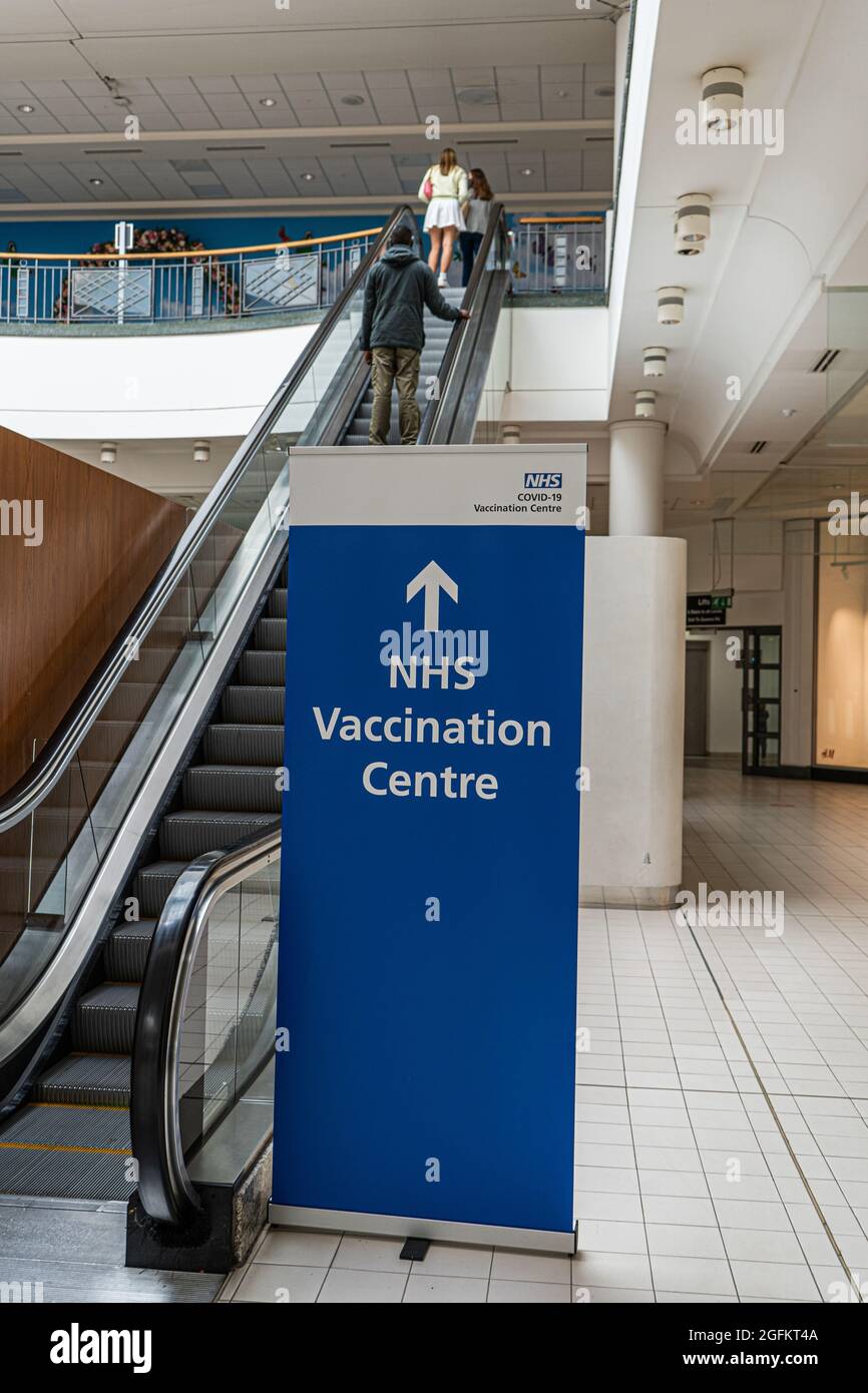An NHS vaccination centre sign at Wimbledon Centre Court shopping mall ...