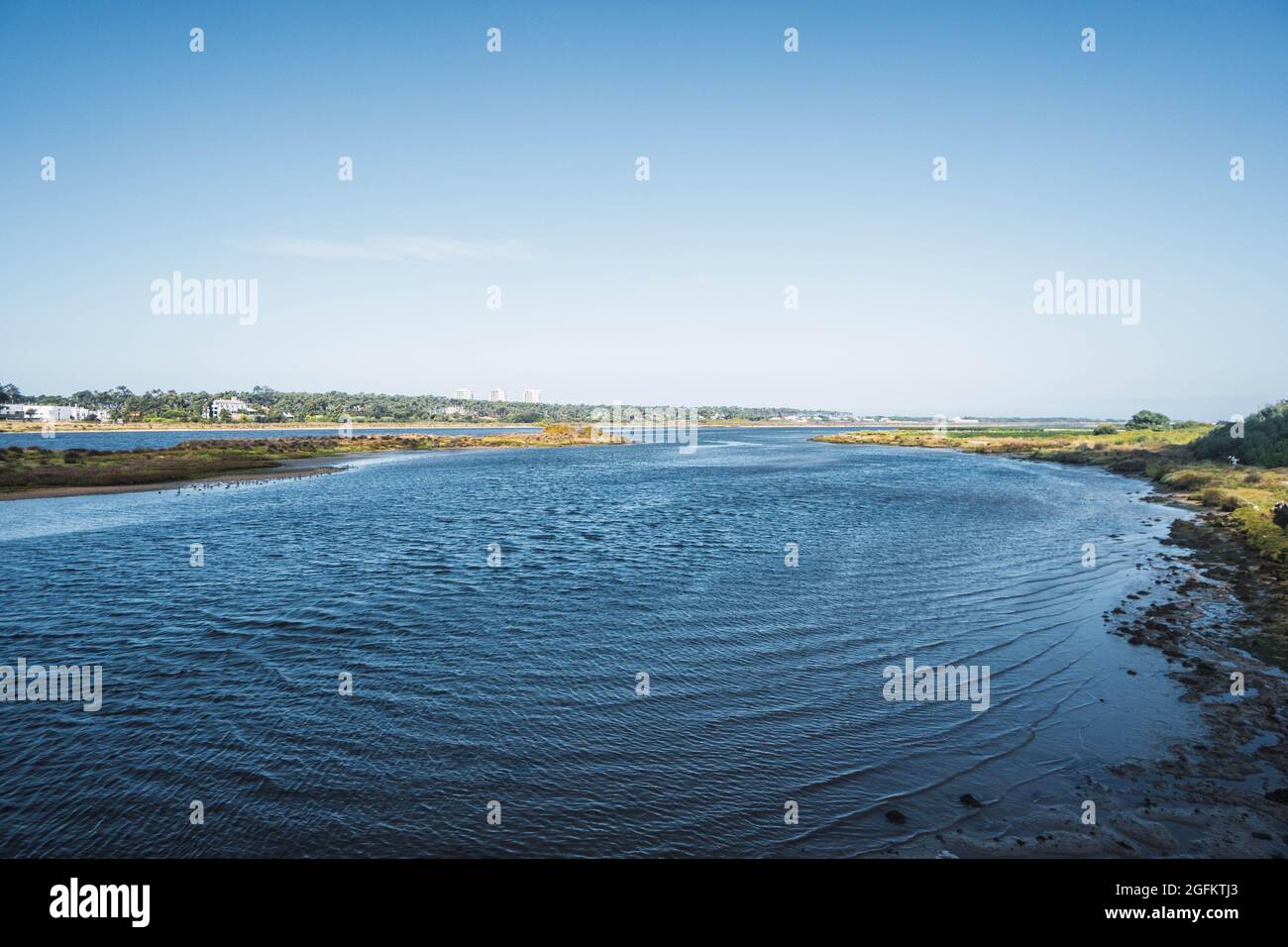 inlet of sea on land surrounded by beach Stock Photo - Alamy