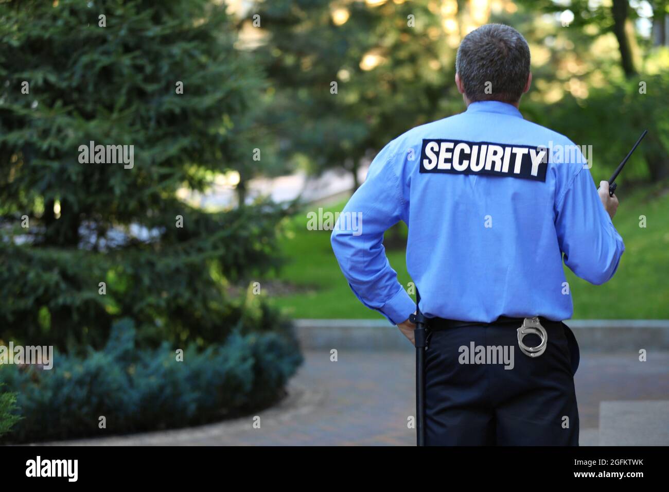 Male security guard protects house Stock Photo - Alamy
