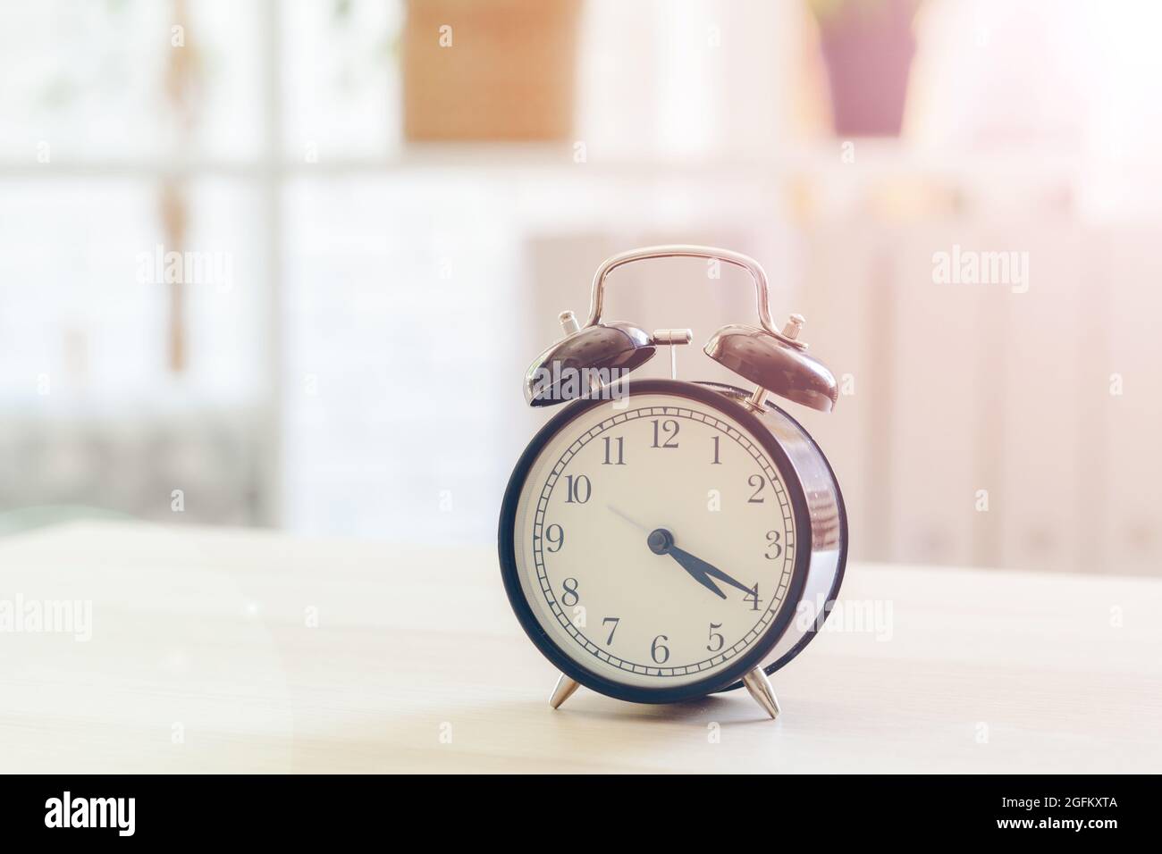 Morning sun. Alarm clock on a beautiful background Stock Photo - Alamy