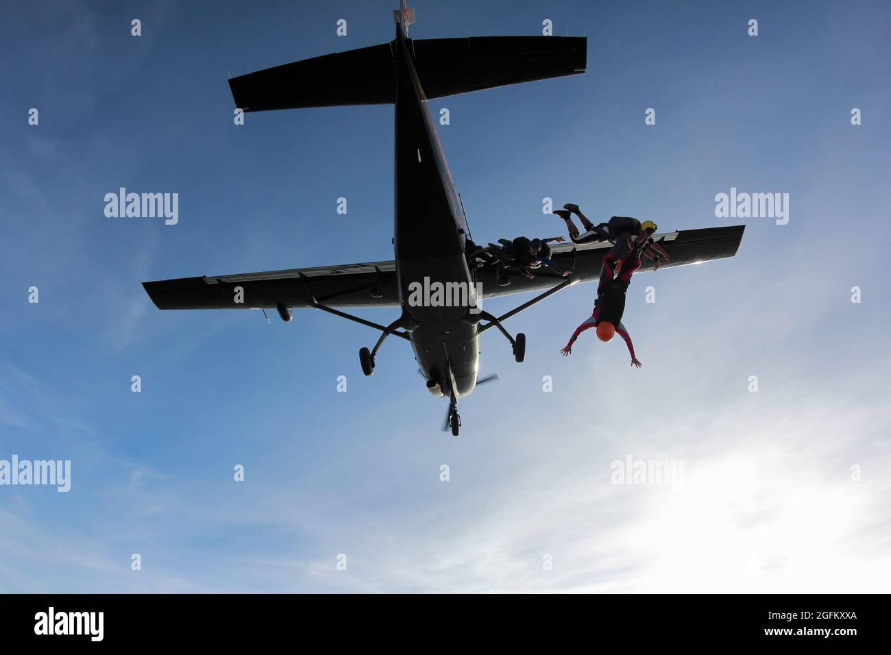 Skydiver jumping from the plane at the sunset Stock Photo - Alamy