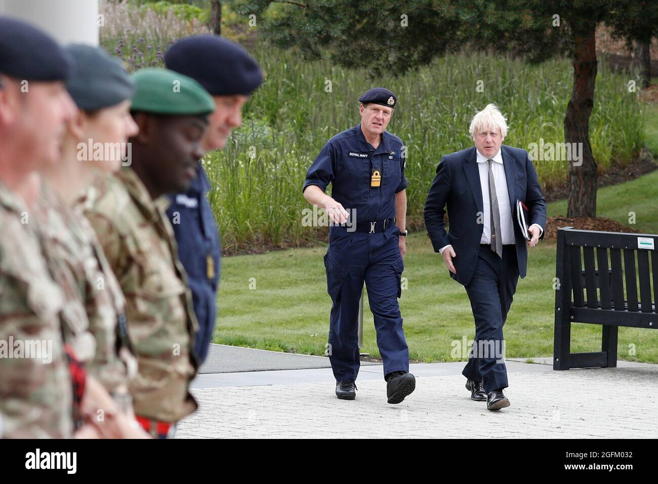Prime Minister Boris Johnson walks with Vice Admiral Ben Key (left) as ...
