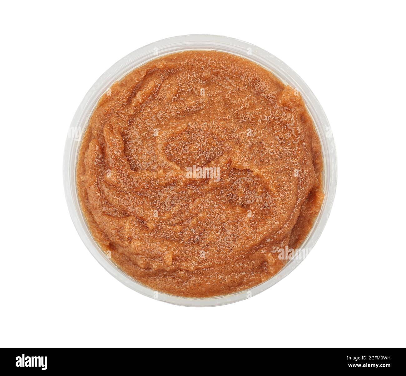 Natural scrub in container on white background Stock Photo - Alamy