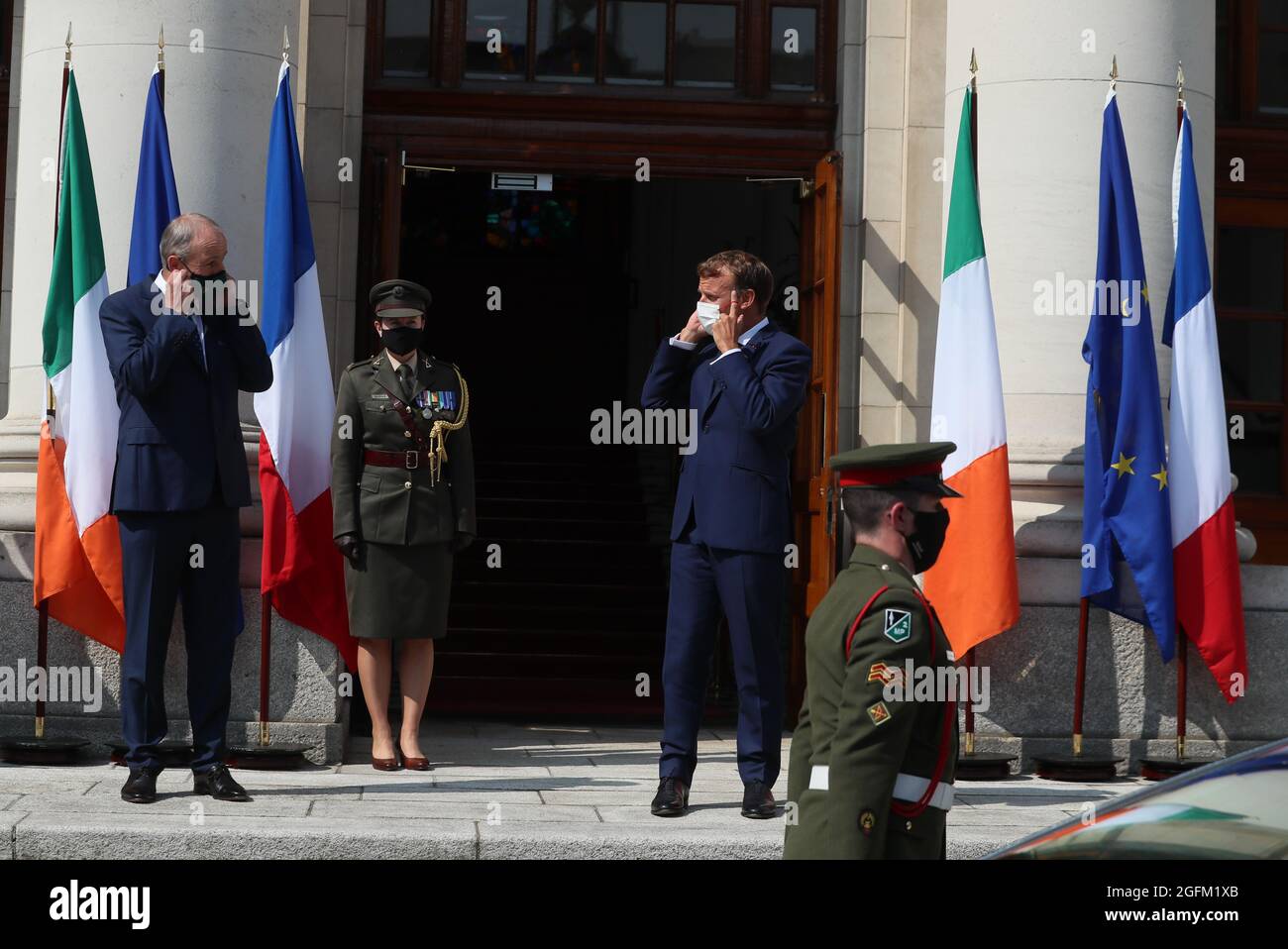 Taoiseach Micheal Martin (left) meets French President Emmanuel Macron ...