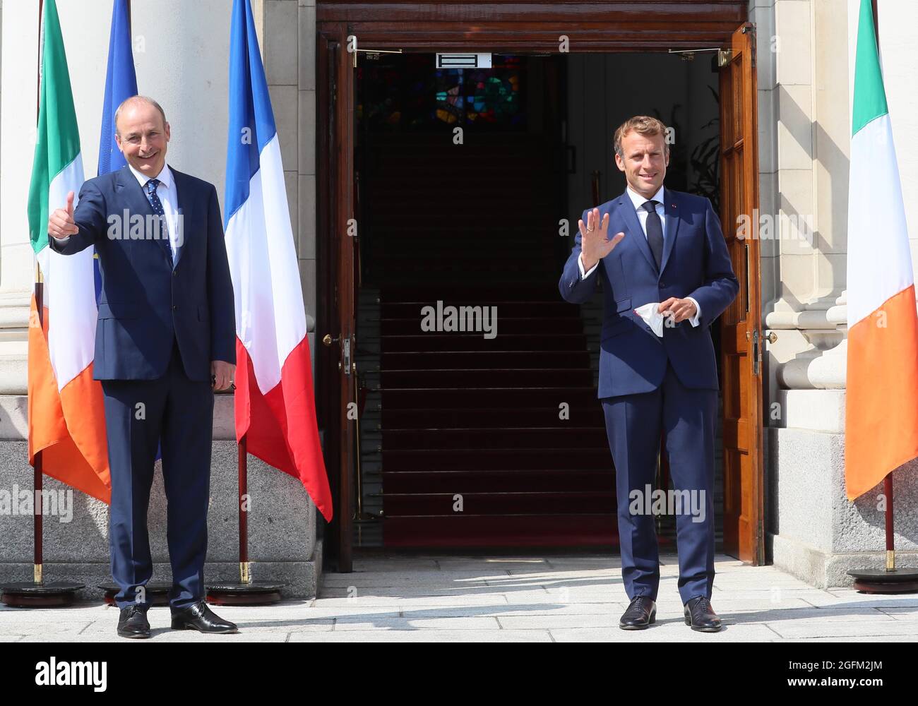 Taoiseach Micheal Martin (left) meets French President Emmanuel Macron ...