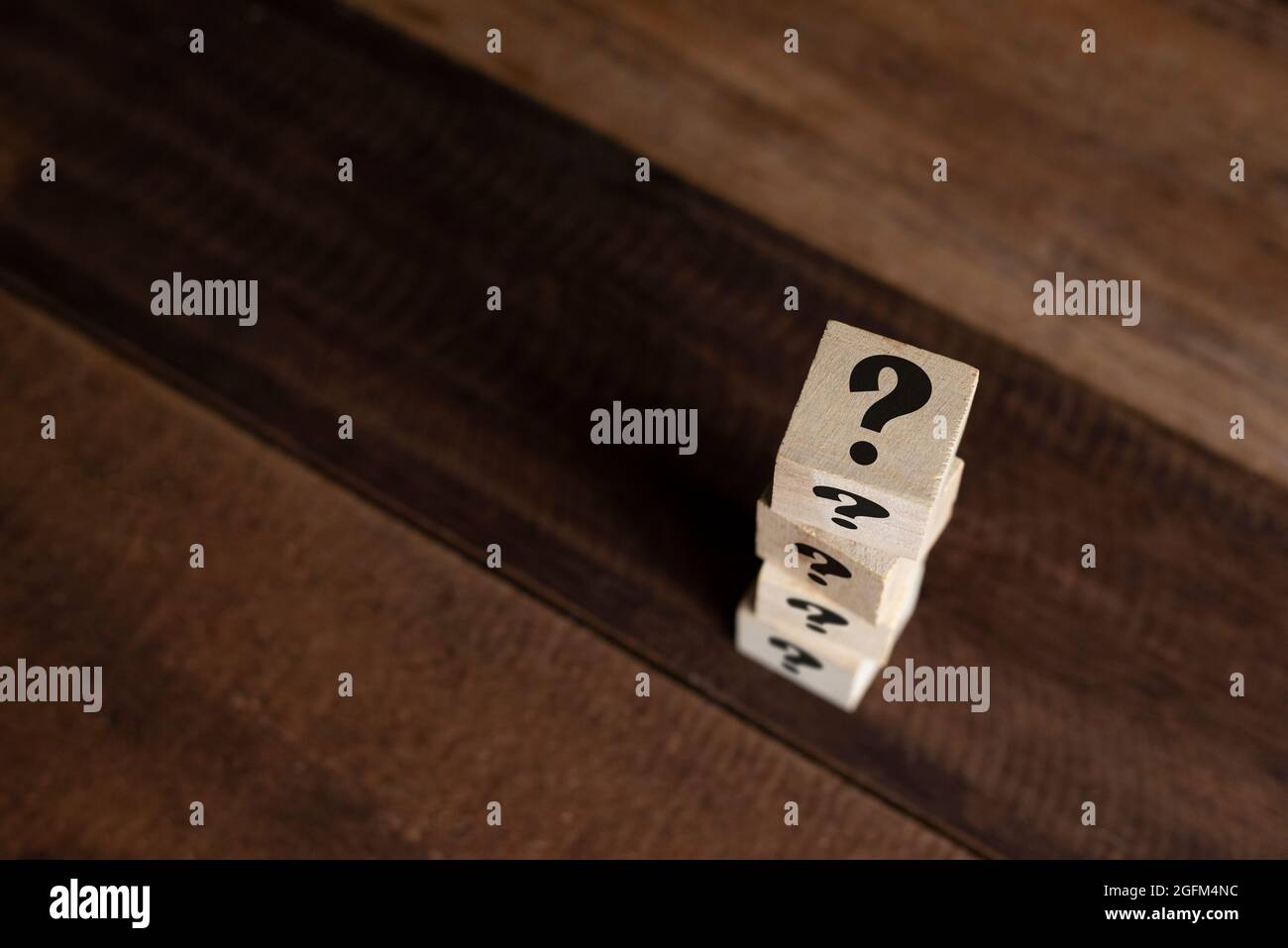 Stacked wooden cube with question mark on table. Concept of FAQ ...