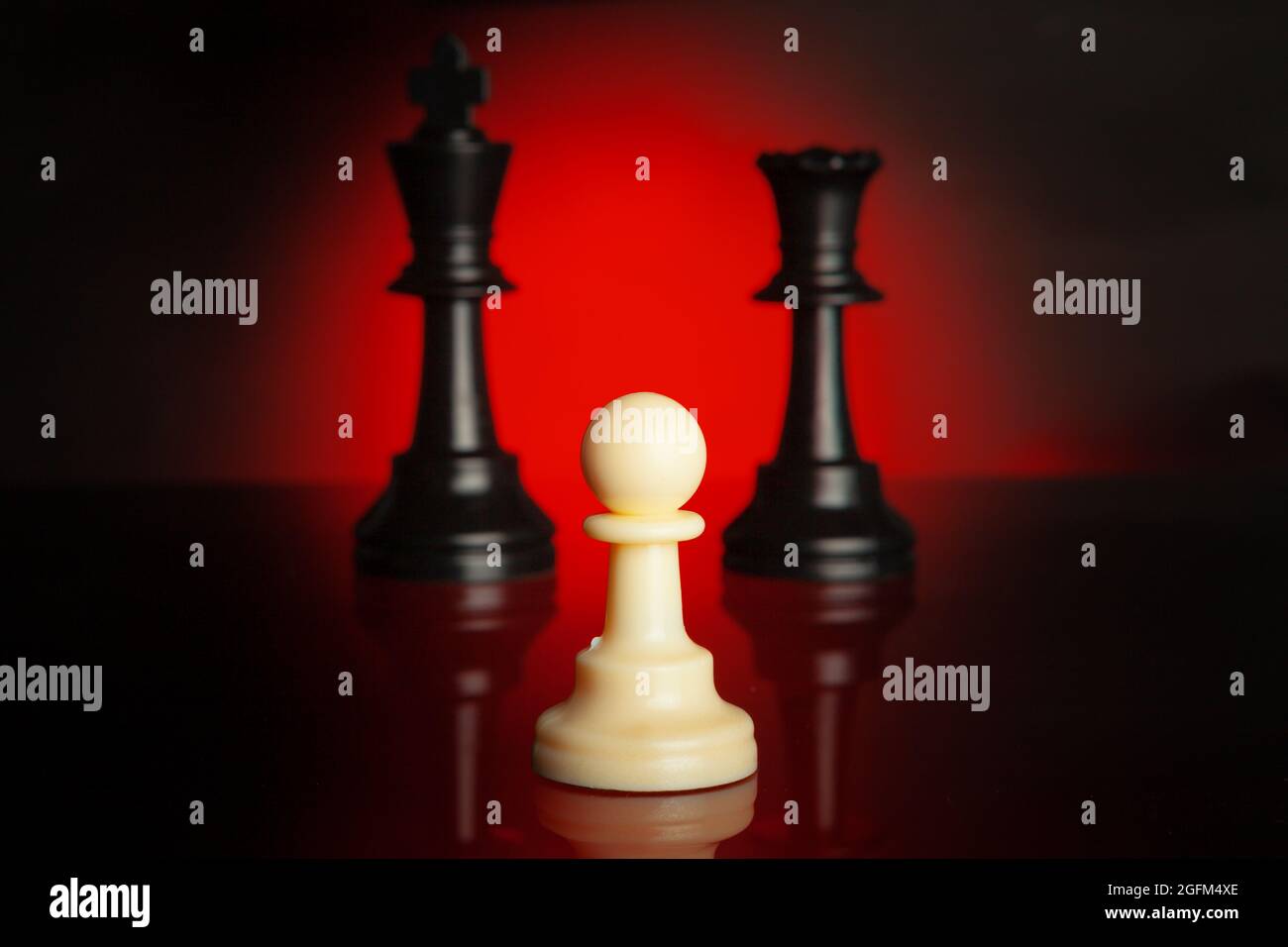 Chess pieces on dark background with red backlight close up Stock Photo ...