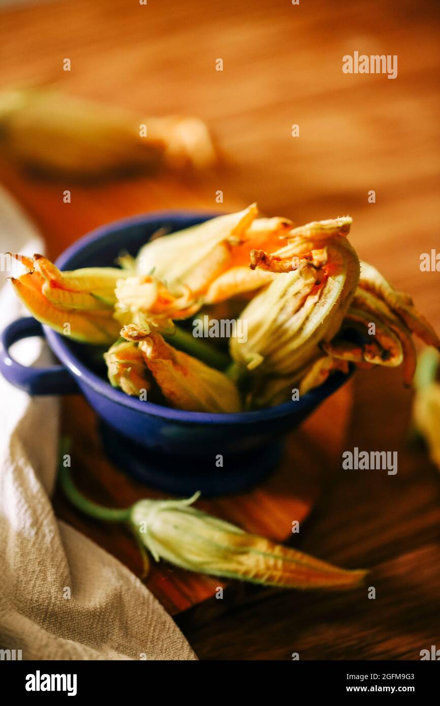 Fresh close up zucchini flowers at the kitchen, delicious Stock Photo ...