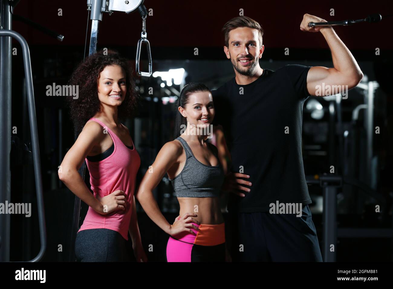 Group of sportive people in gym Stock Photo - Alamy