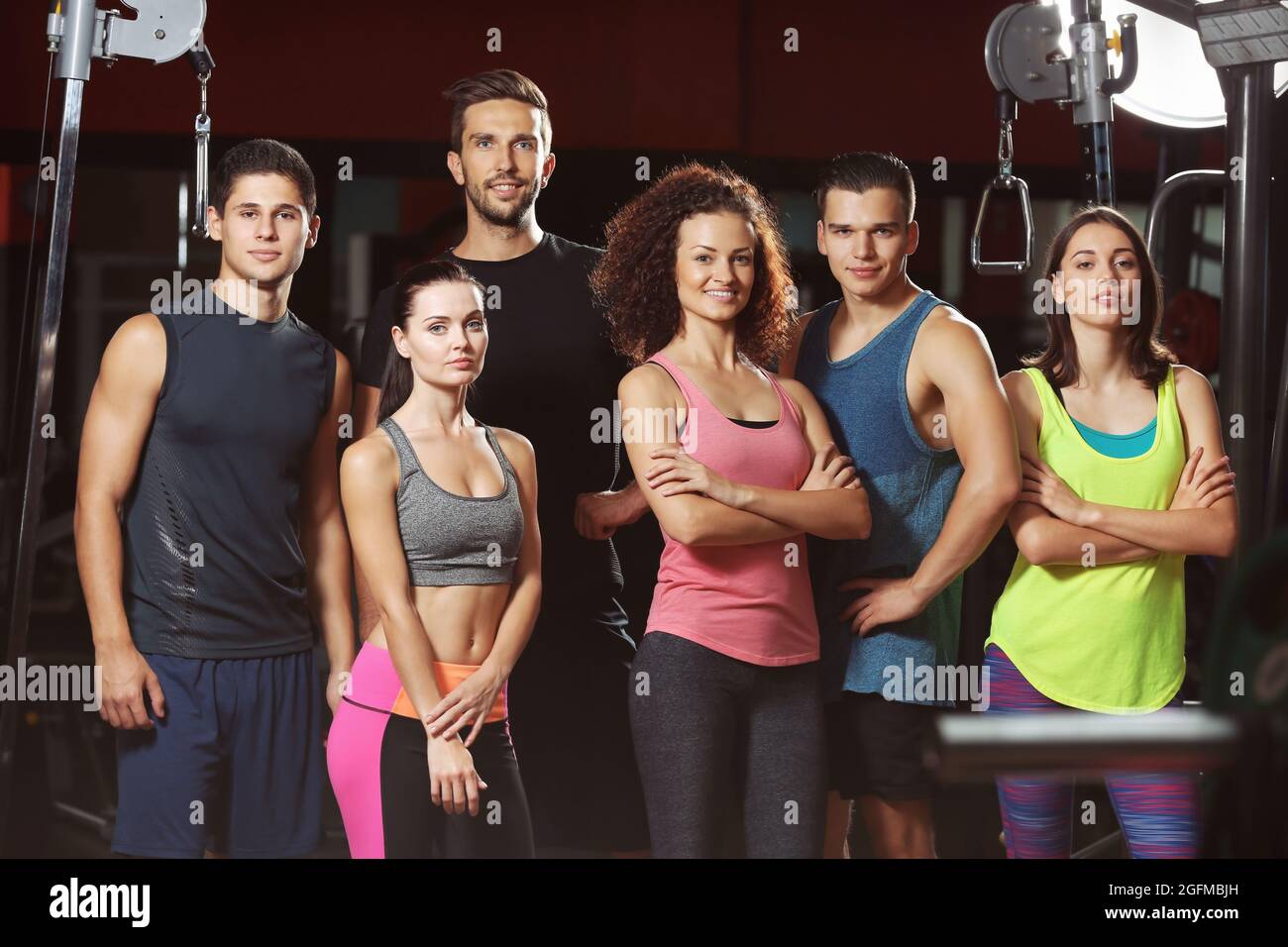 Group of sportive people in gym Stock Photo - Alamy