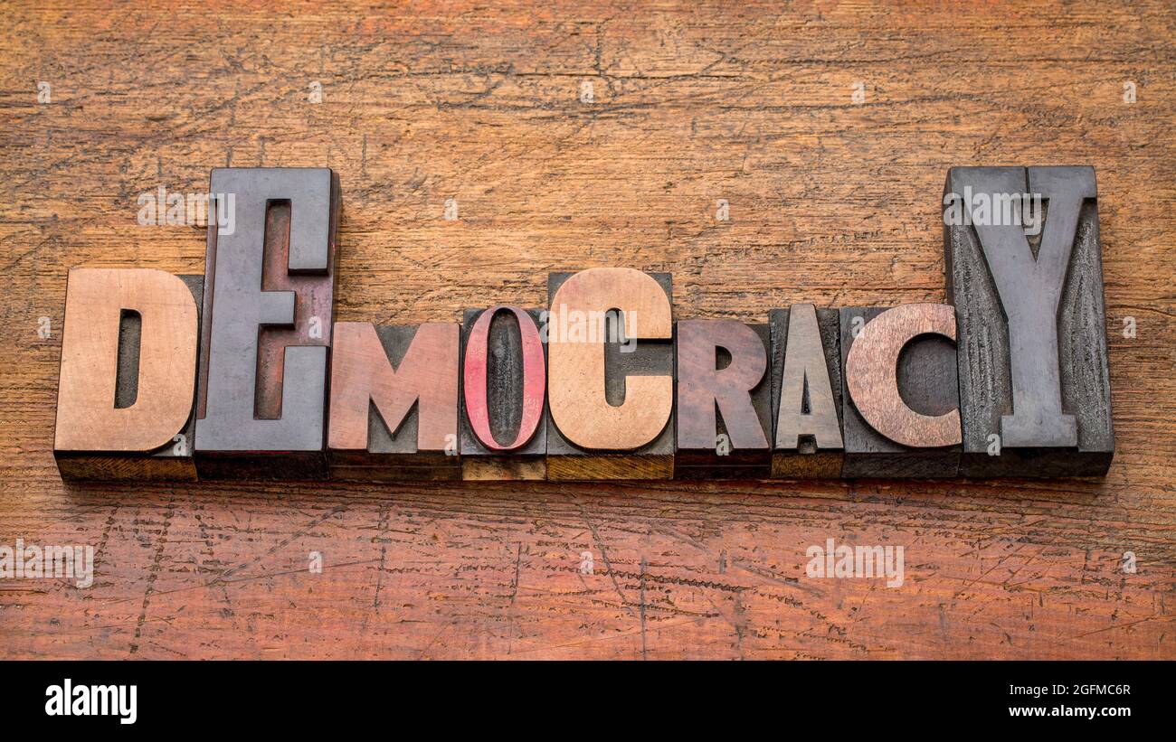 democracy word abstract in mixed vintage letterpress wood type against ...
