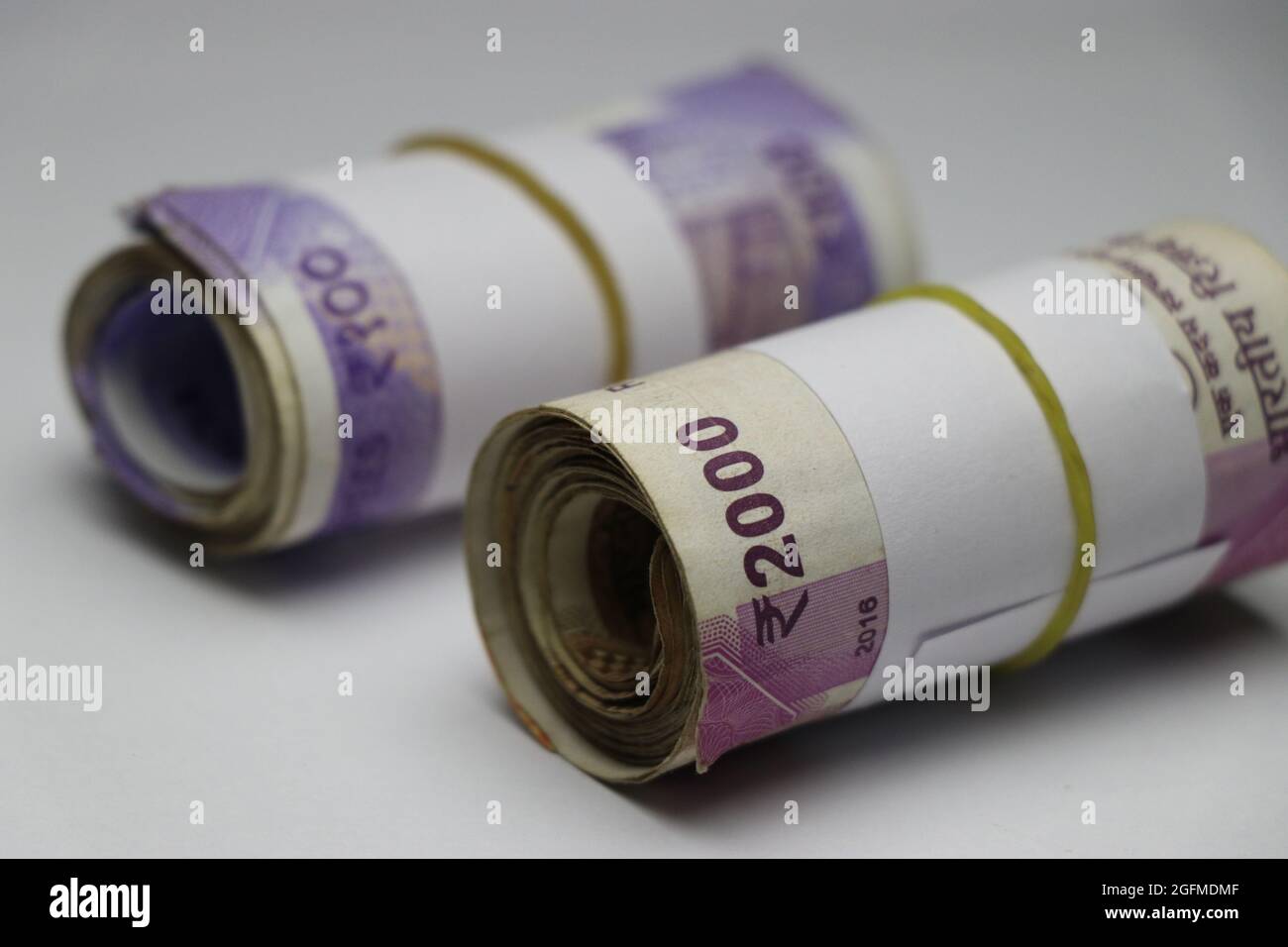 New Indian currency notes 2000 and 200 in a bundle isolated on white ...