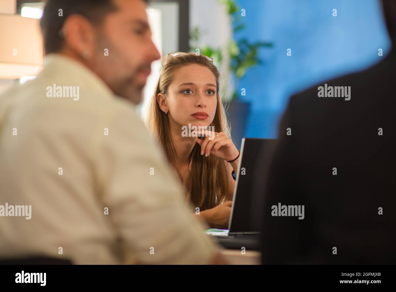All business people at the meeting are listening their female boss ...