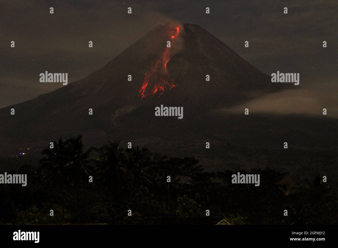 This picture shows Mount Merapi, Indonesias most active volcano, emits ...