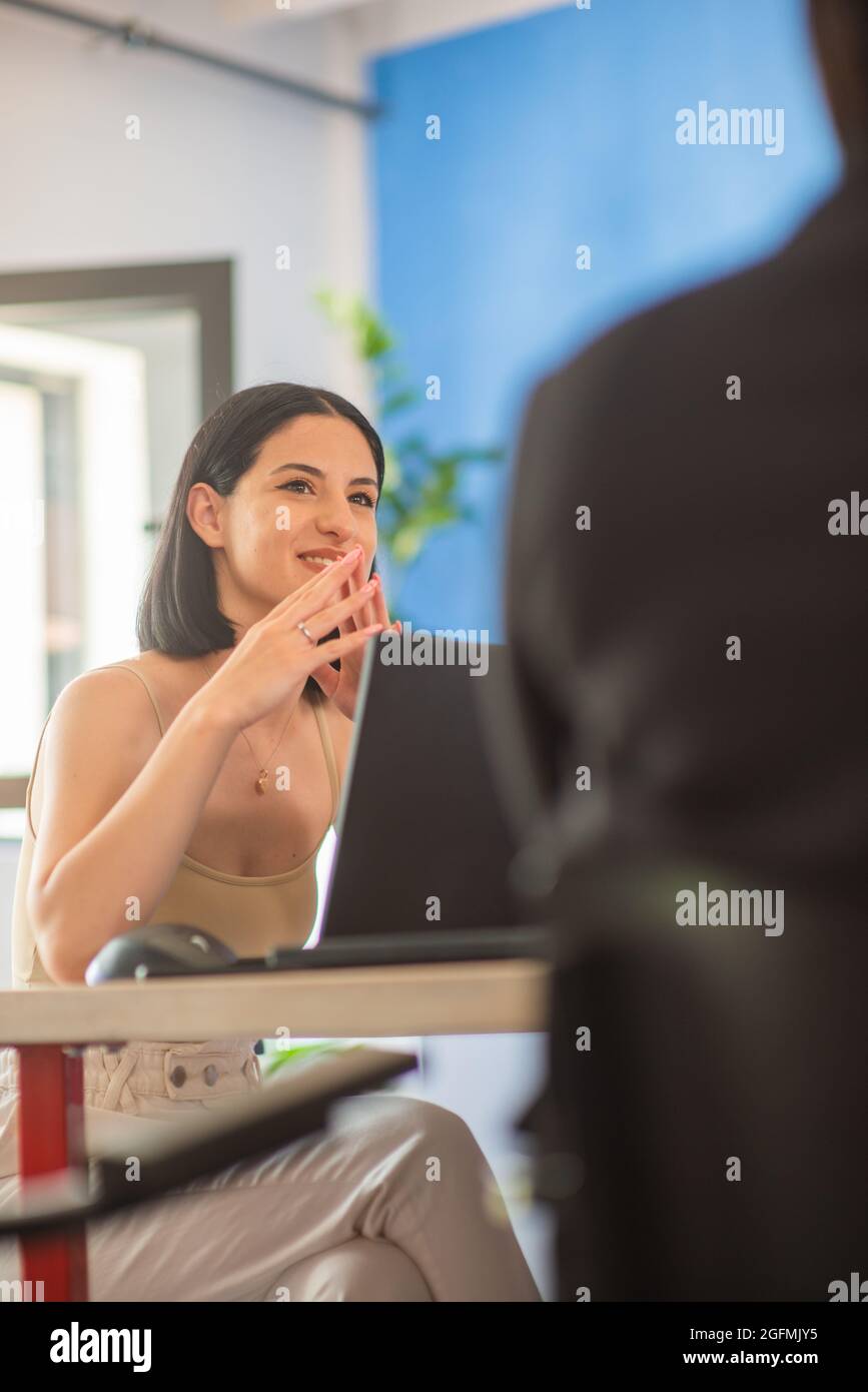 Attractive female boss is having a big meeting with her business ...