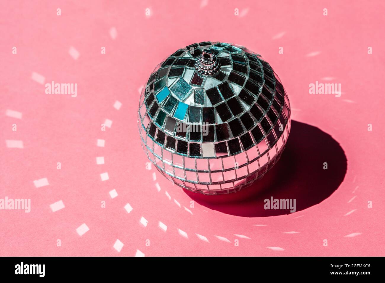 disco ball bauble on pink background. party concept Stock Photo - Alamy