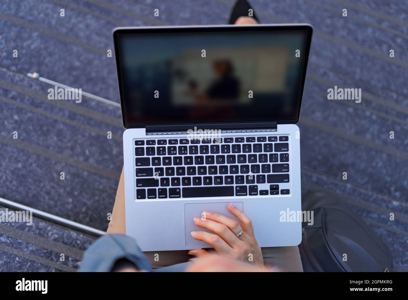 CLOSE UP WOMAN HAND WORKING ON LAPTOP OUTDOORS WHILE SITTING Stock ...